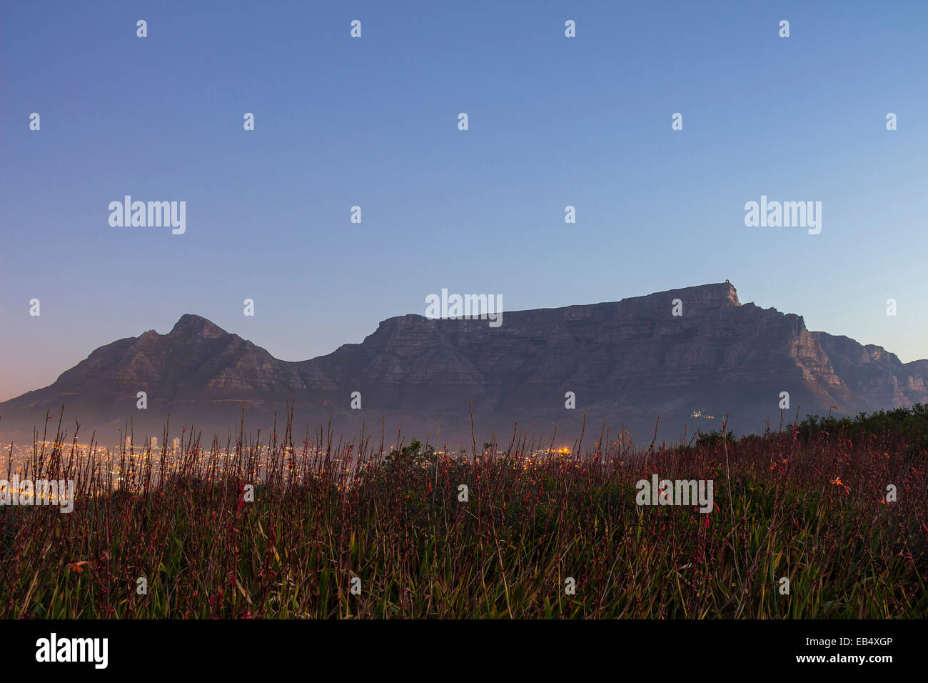 Table Mountain at dusk with city lights Stock Photo - Alamy