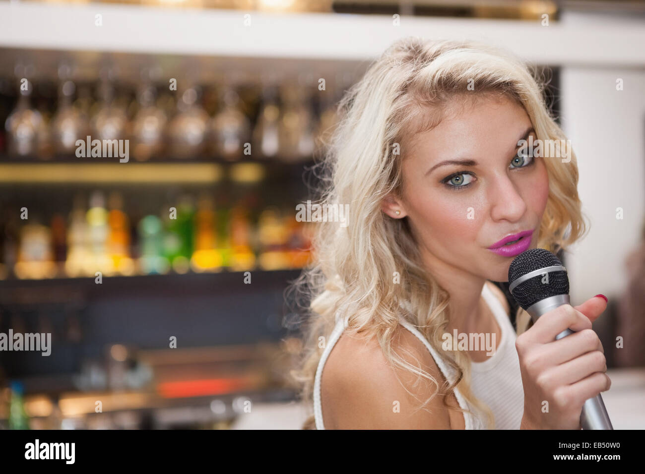 Pretty blonde woman singing hi-res stock photography and images - Alamy