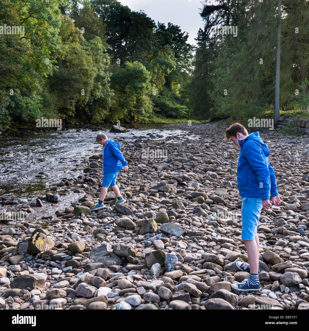 Children playing on the river Swale at Swaledale in the Yorkshire Dales ...