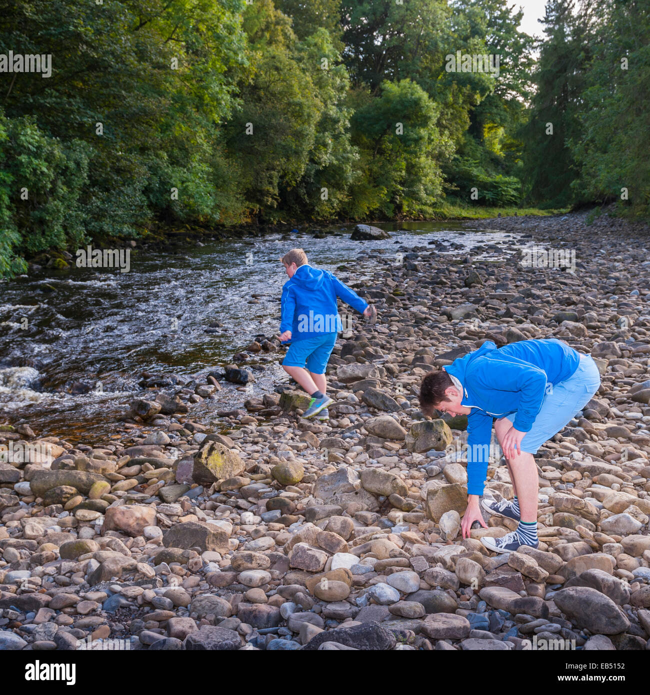 Children playing on the river Swale at Swaledale in the Yorkshire Dales ...