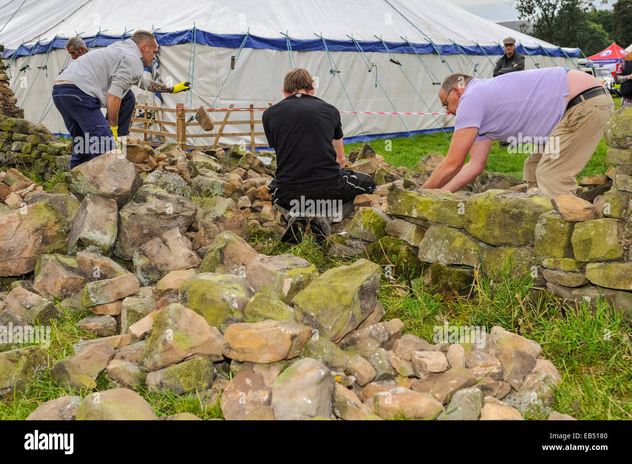 A drystone wall building competition at Reeth show , Swaledale in the ...