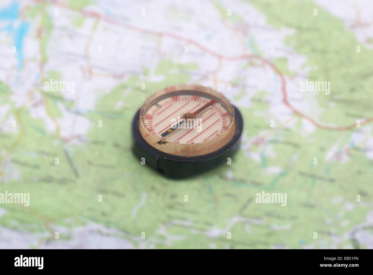 Compass over the topographic map- concept background Stock Photo - Alamy