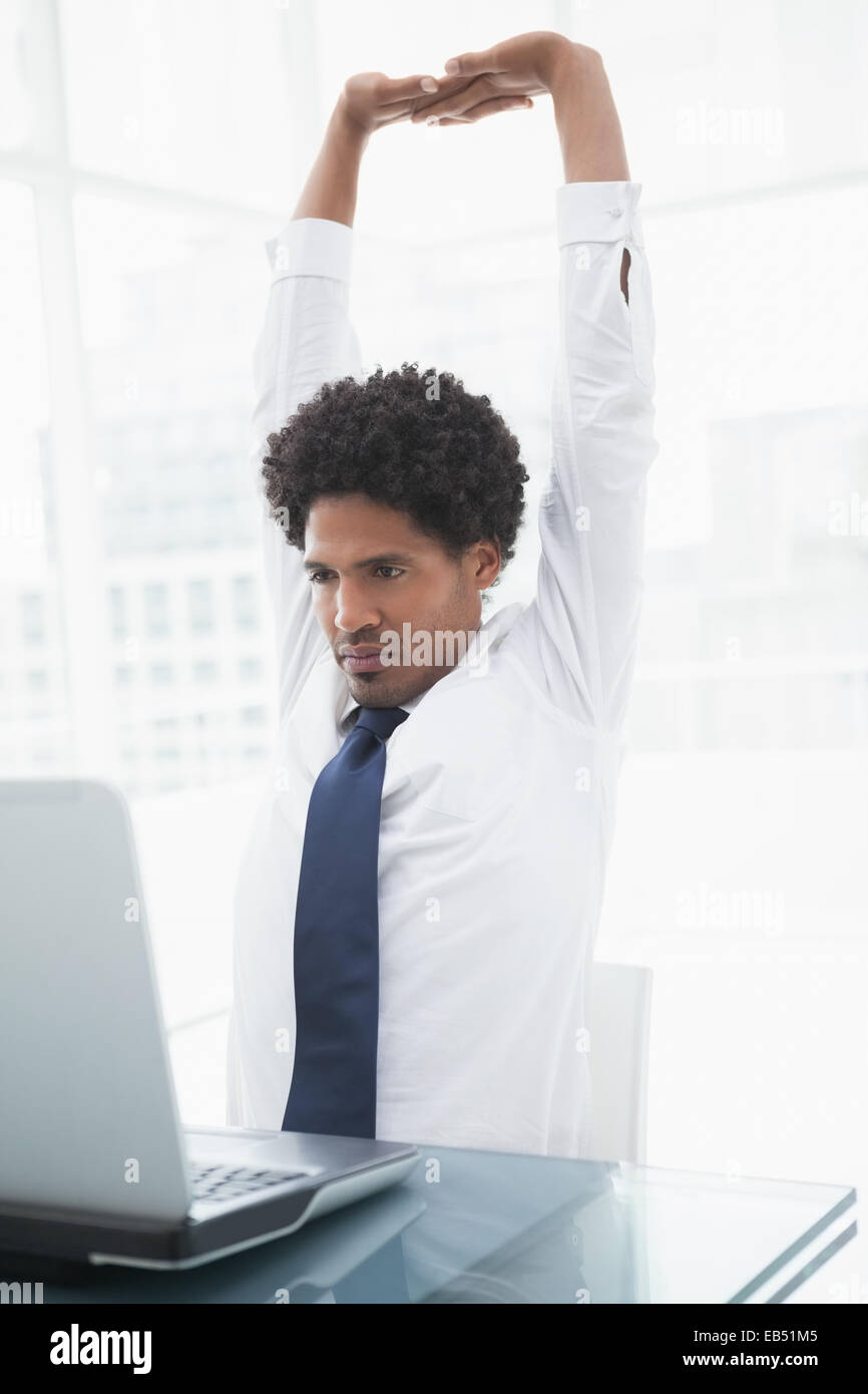 Man stretching in office hi-res stock photography and images - Alamy