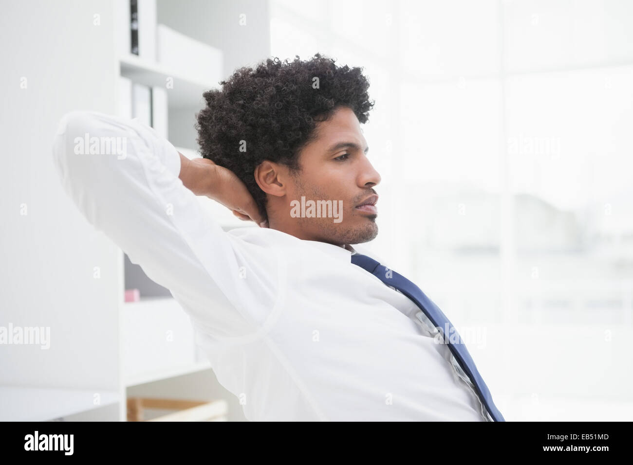 Peaceful businessman relaxing at work Stock Photo - Alamy