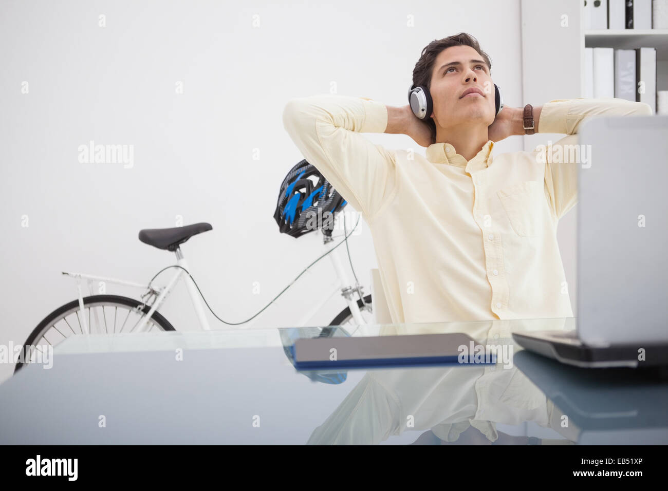 Relaxed designer leaning back in his chair Stock Photo - Alamy