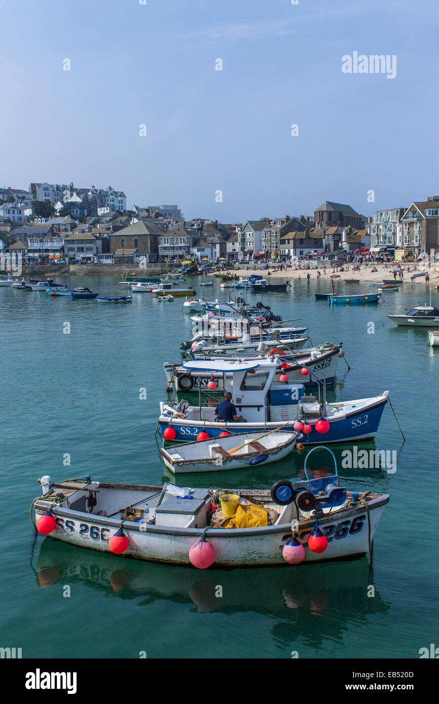 A line of fishing boats on a summery day in St Ives harbour, Cornwall ...