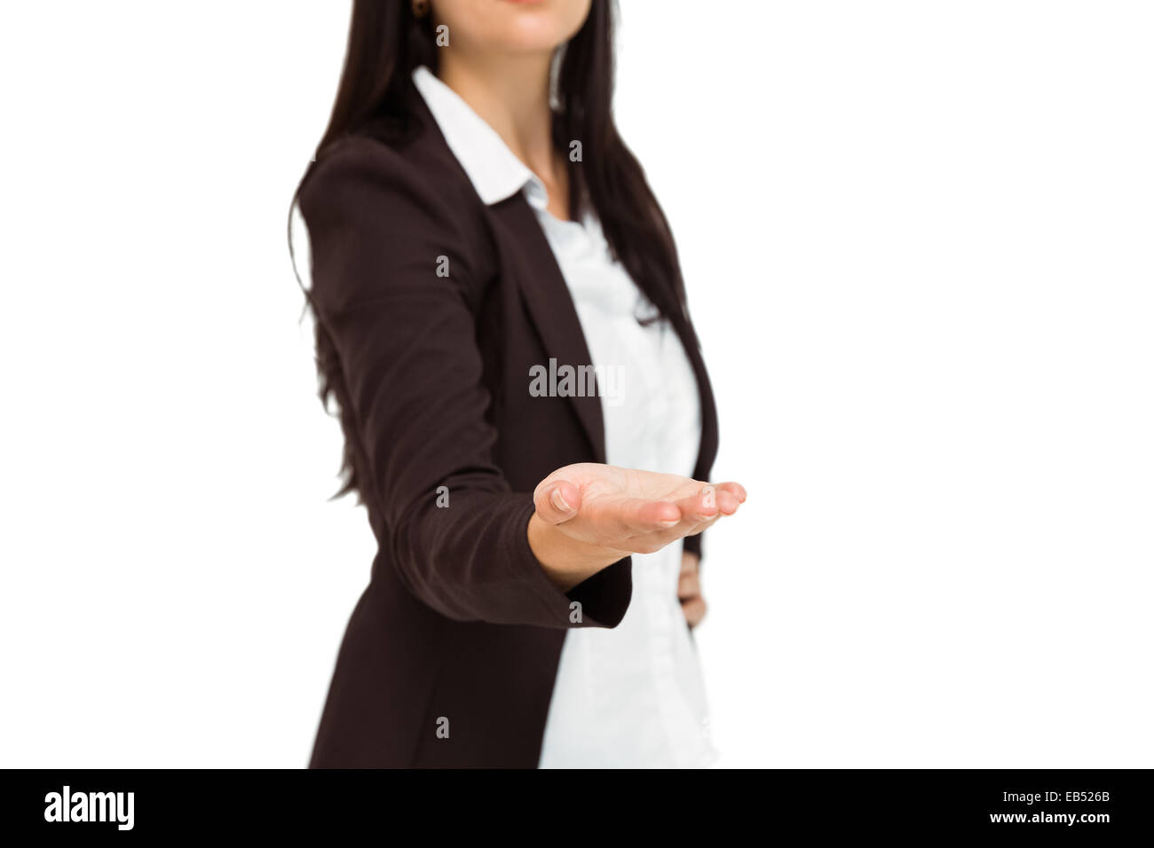 Pretty businesswoman presenting with hand Stock Photo - Alamy