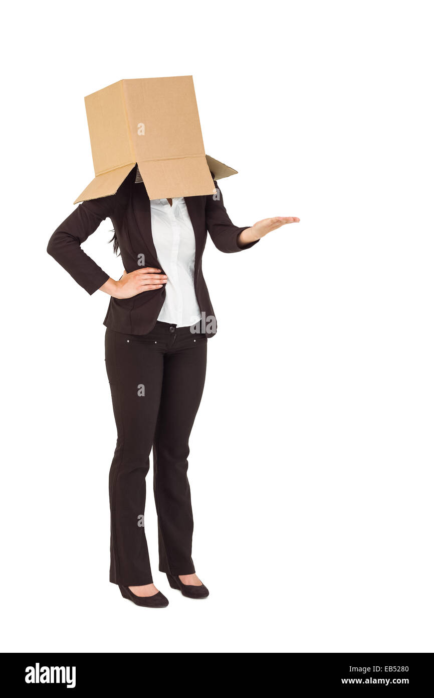 Businesswoman presenting with box over head Stock Photo - Alamy