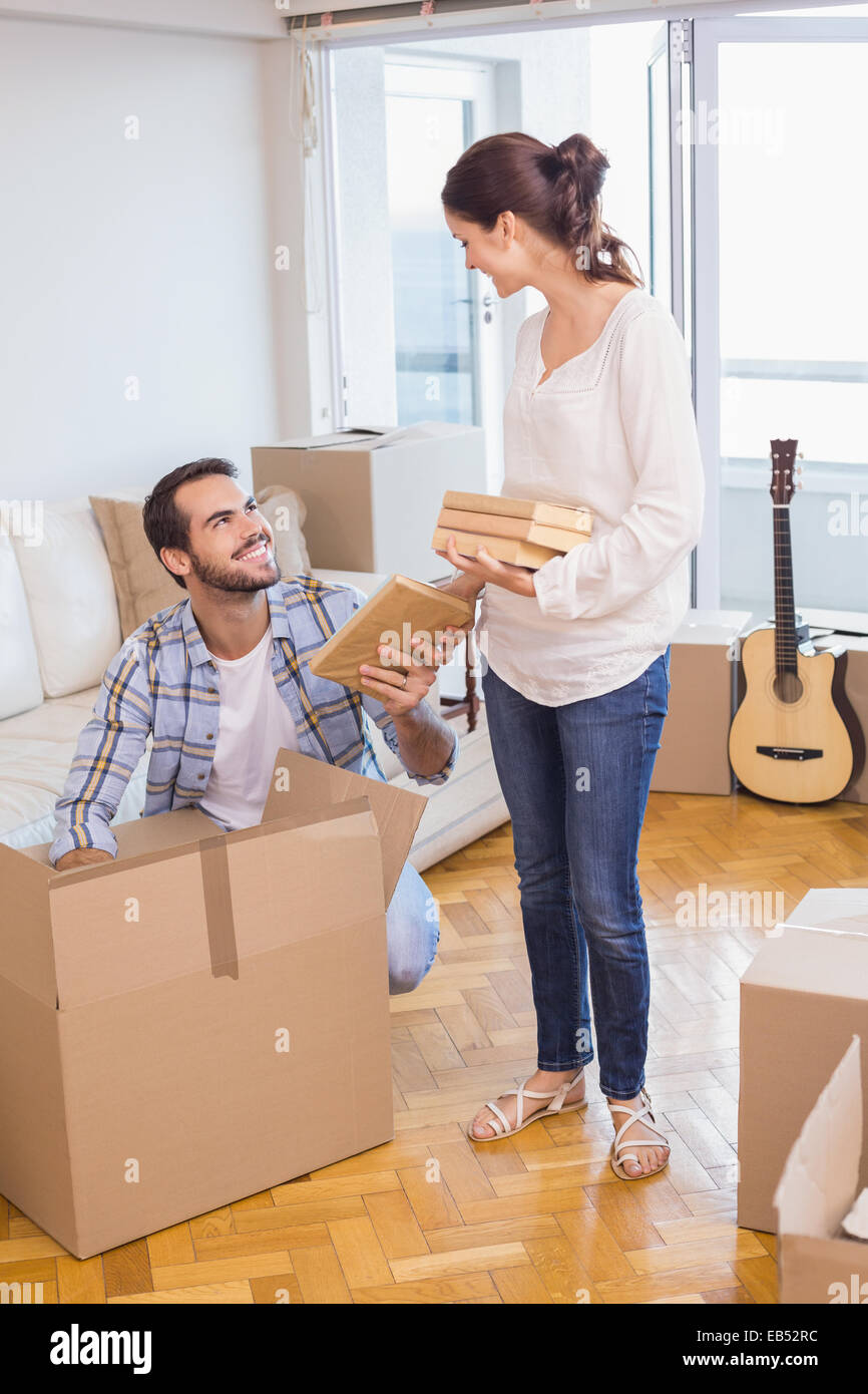 Cute couple unpacking cardboard boxes Stock Photo - Alamy