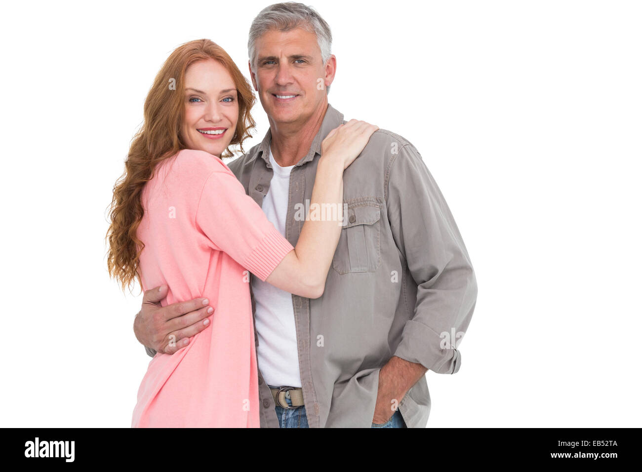 Casual couple hugging and smiling Stock Photo - Alamy