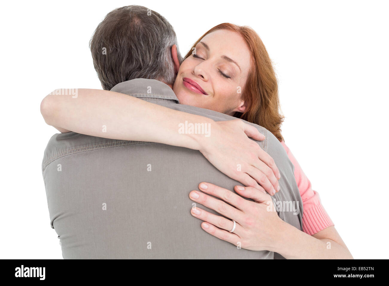 Casual couple hugging each other Stock Photo - Alamy