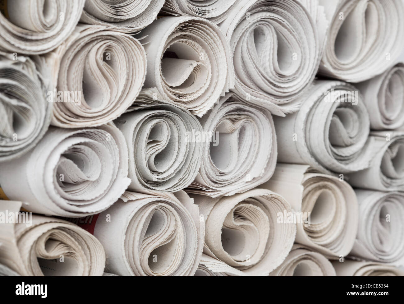 Rolls of newspapers Stock Photo - Alamy