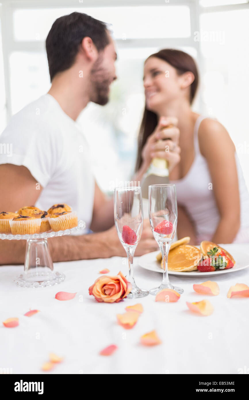 Young couple having a romantic breakfast Stock Photo - Alamy
