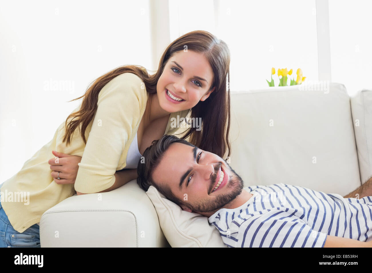 Cute couple relaxing on couch Stock Photo - Alamy
