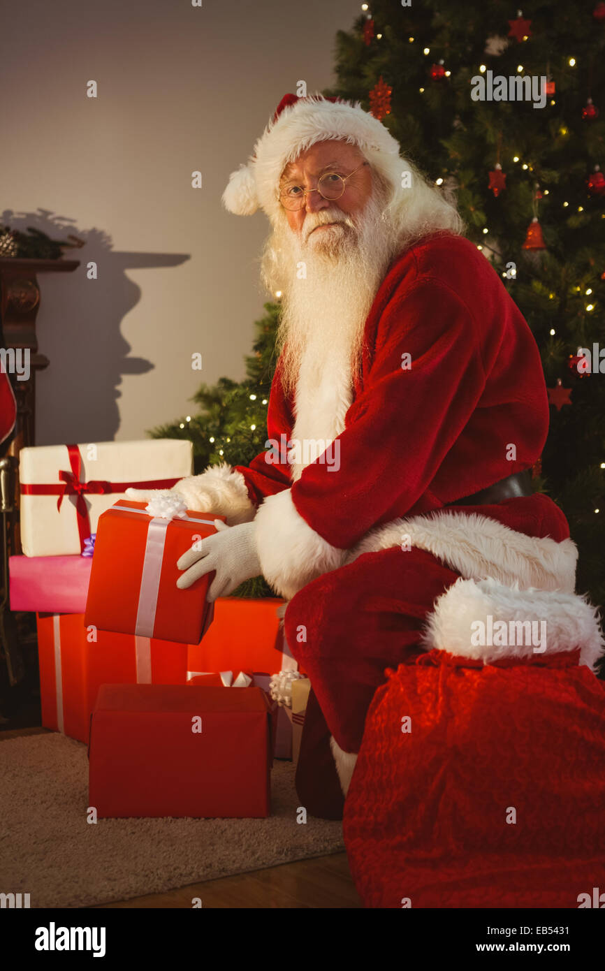 Portrait of santa delivering gifts at christmas eve Stock Photo - Alamy
