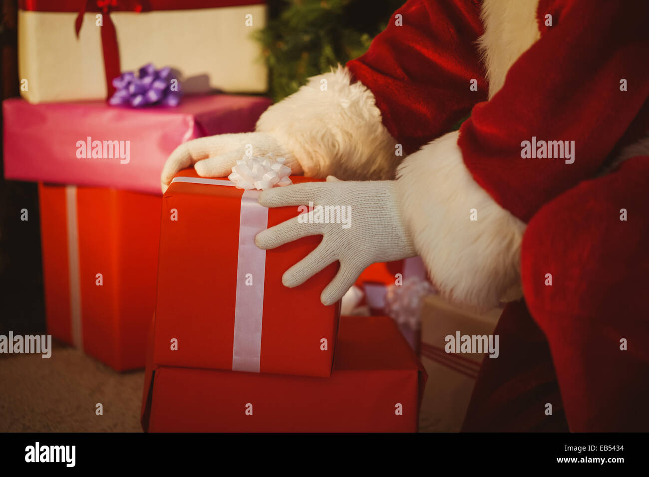 Santa claus delivering presents Stock Photo - Alamy