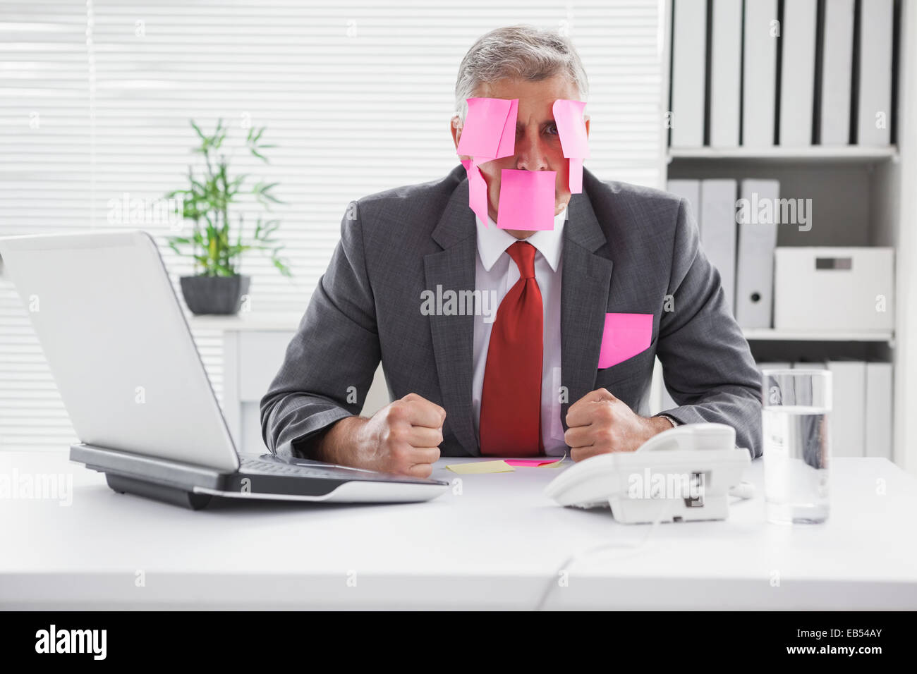 Overwhelmed businessman with sticky notes on head Stock Photo - Alamy