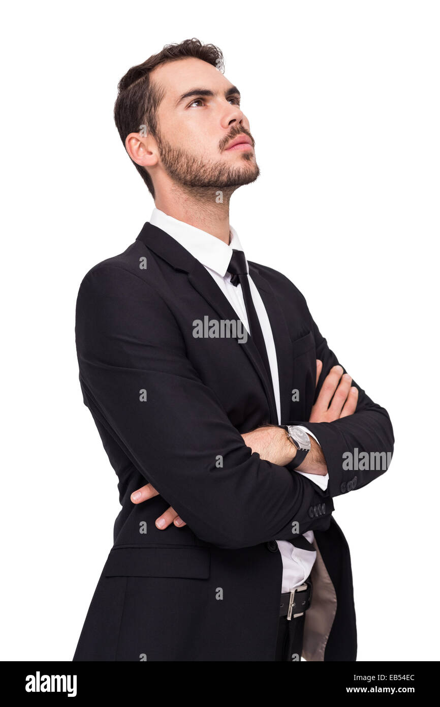Thinking businessman with his arms crossed Stock Photo - Alamy
