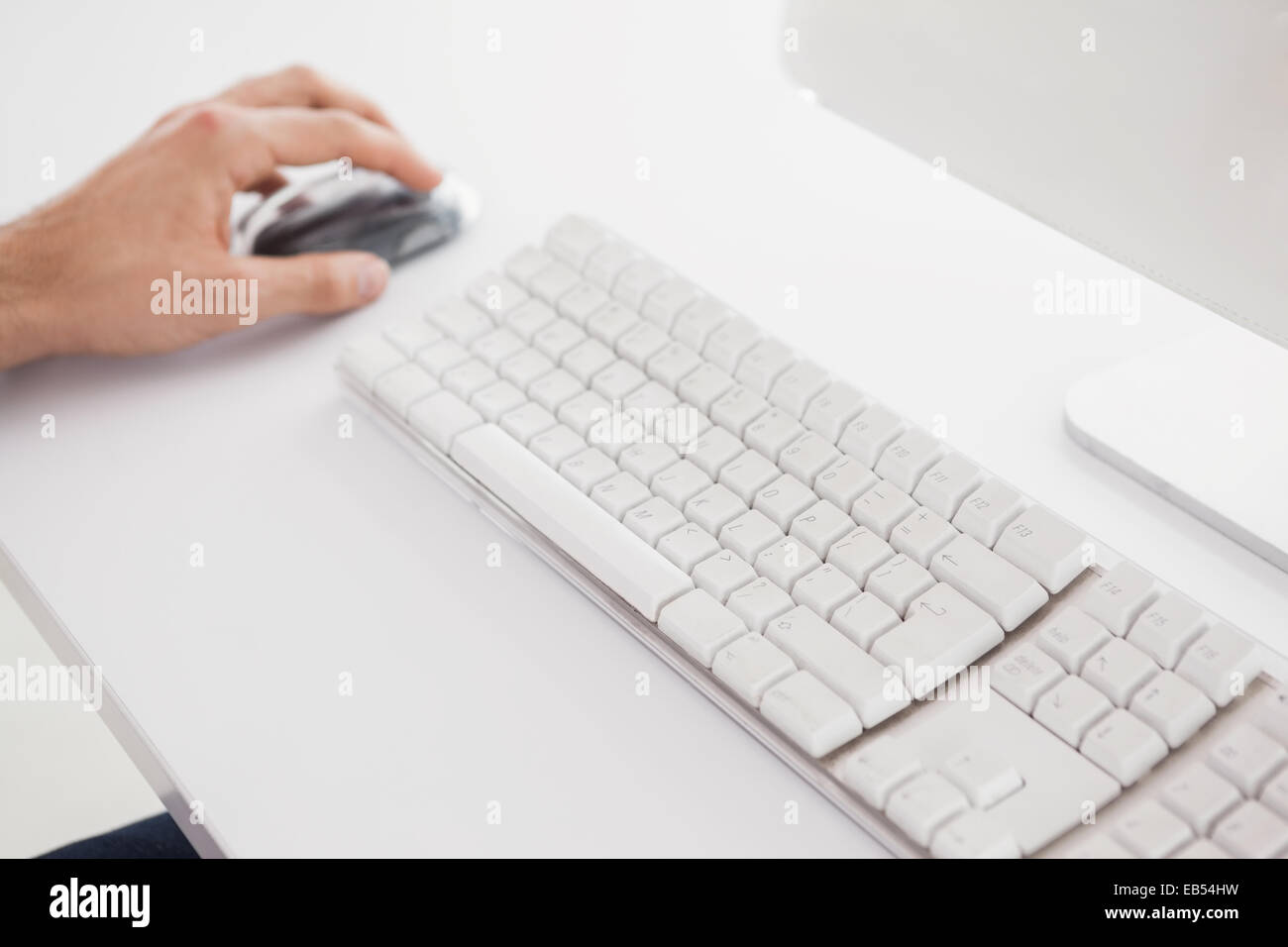 Businessman using the computer mouse Stock Photo - Alamy