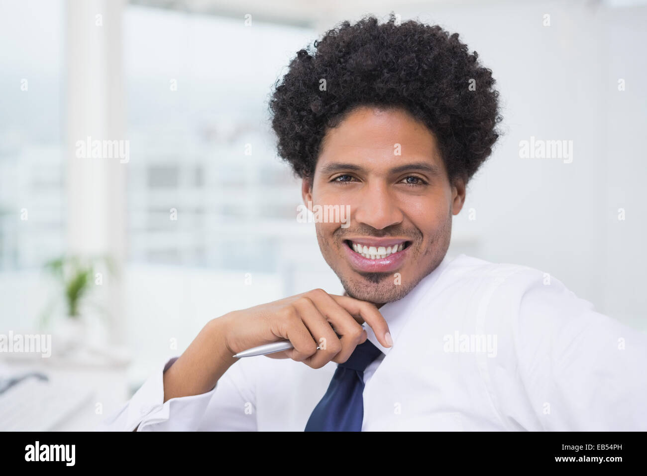 Handsome photo editor working at desk Stock Photo - Alamy
