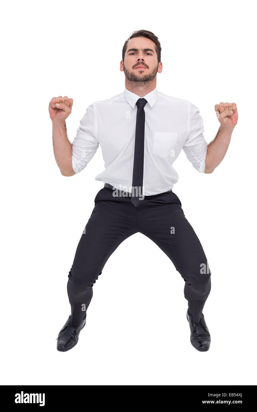 Focused businessman lifting up something heavy Stock Photo - Alamy