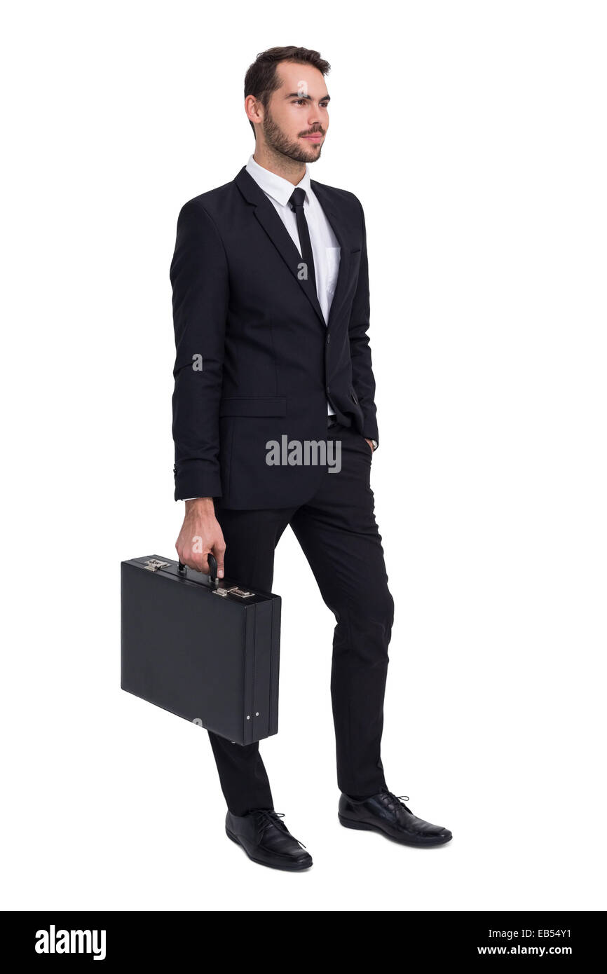 Businessman standing holding briefcase hand hi-res stock photography ...