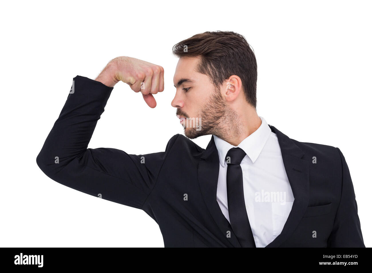 Cheerful businessman tensing arm muscle Stock Photo - Alamy