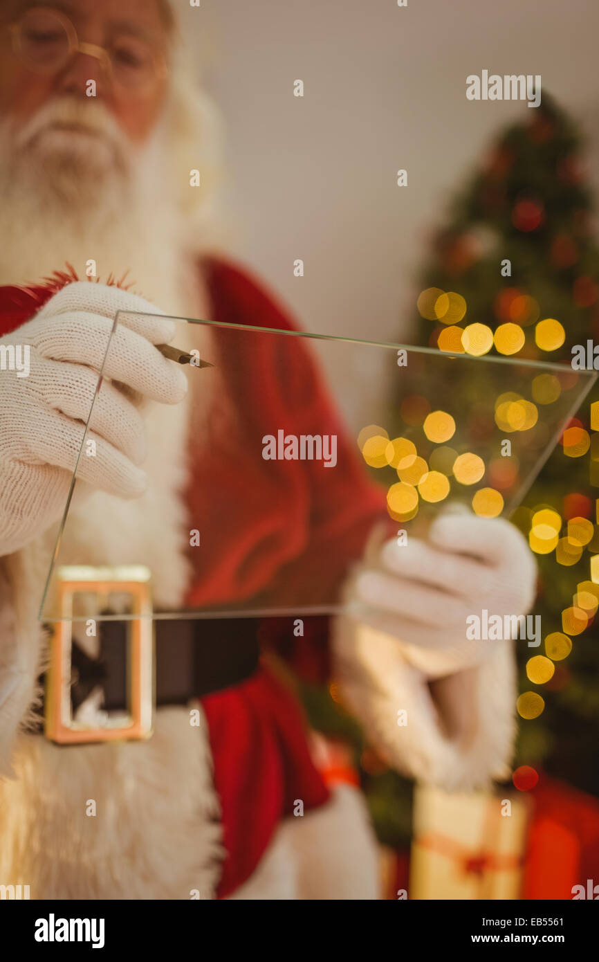 Santa claus writing list on pane Stock Photo - Alamy