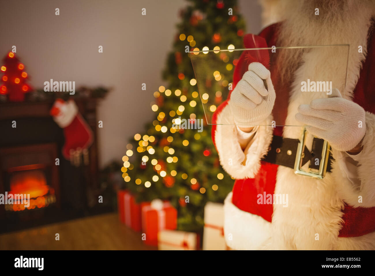 Mid section of santa writing list on pane Stock Photo - Alamy