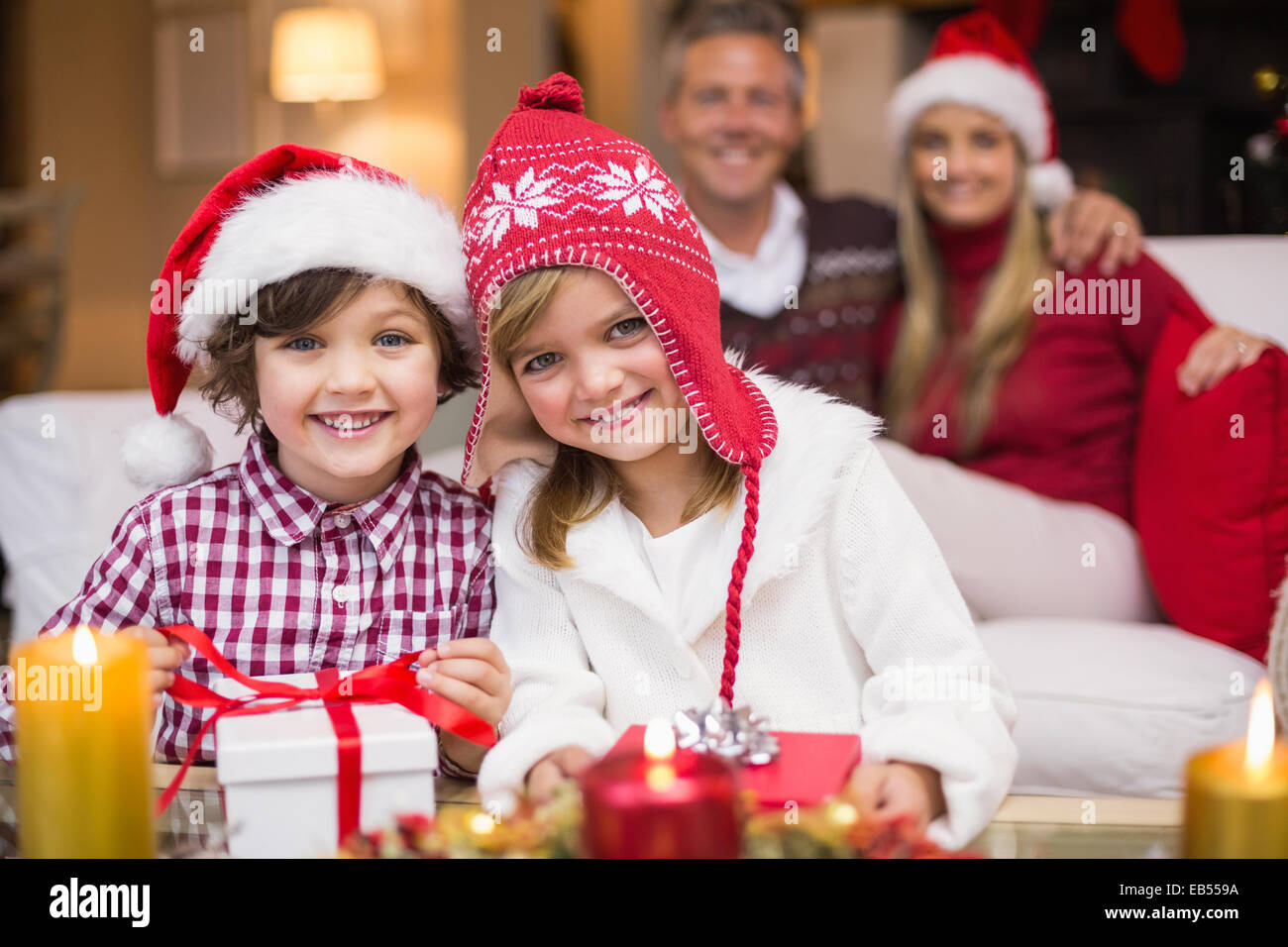 Cute family celebrating christmas together Stock Photo - Alamy