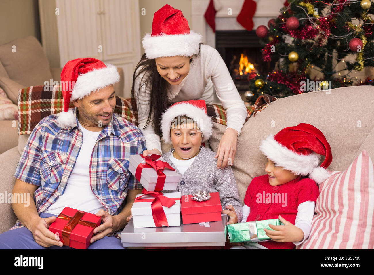 Surprised son opening gifts hi-res stock photography and images - Alamy