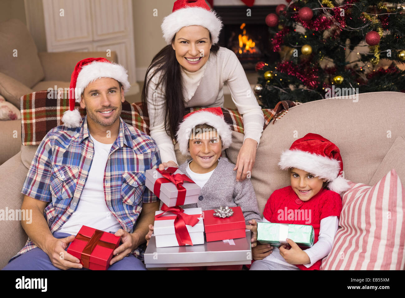 Happy son opening his gifts Stock Photo - Alamy