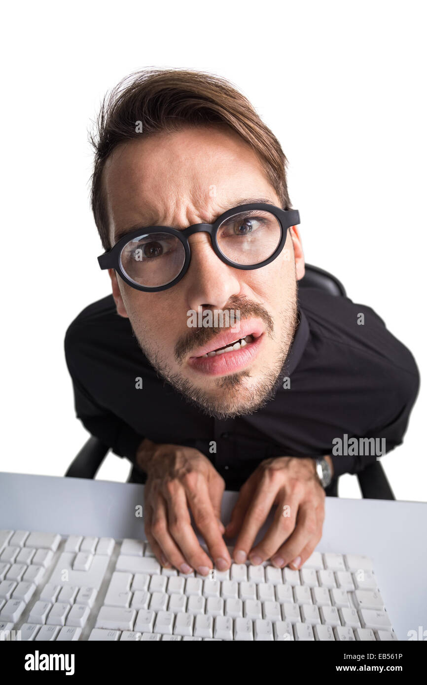 Thoughtful businessman with glasses using computer Stock Photo - Alamy