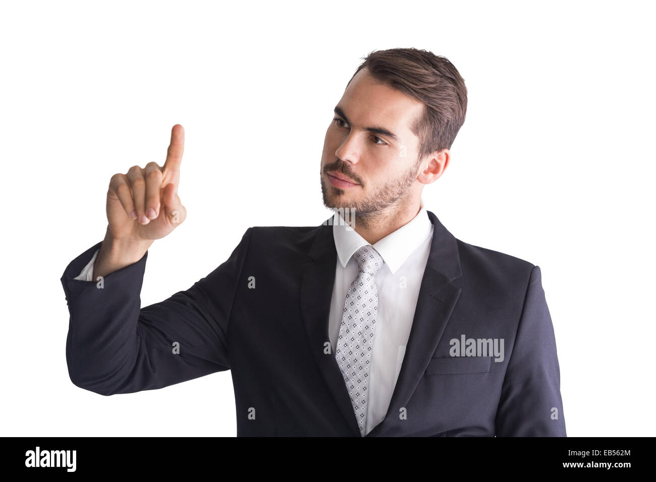 Thoughtful businessman pointing something with his finger Stock Photo ...