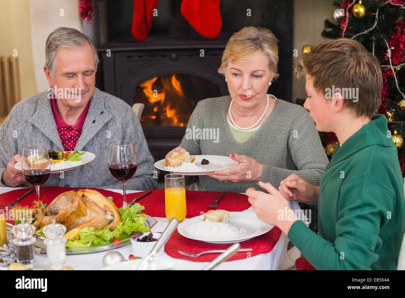 Smiling extended family at the christmas dinner table Stock Photo - Alamy