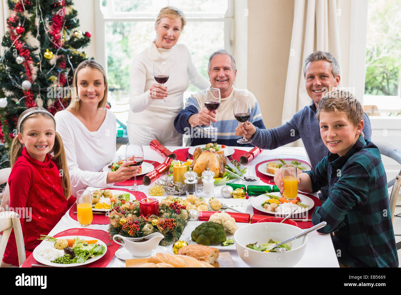 Family toasting at camera with red wine Stock Photo - Alamy