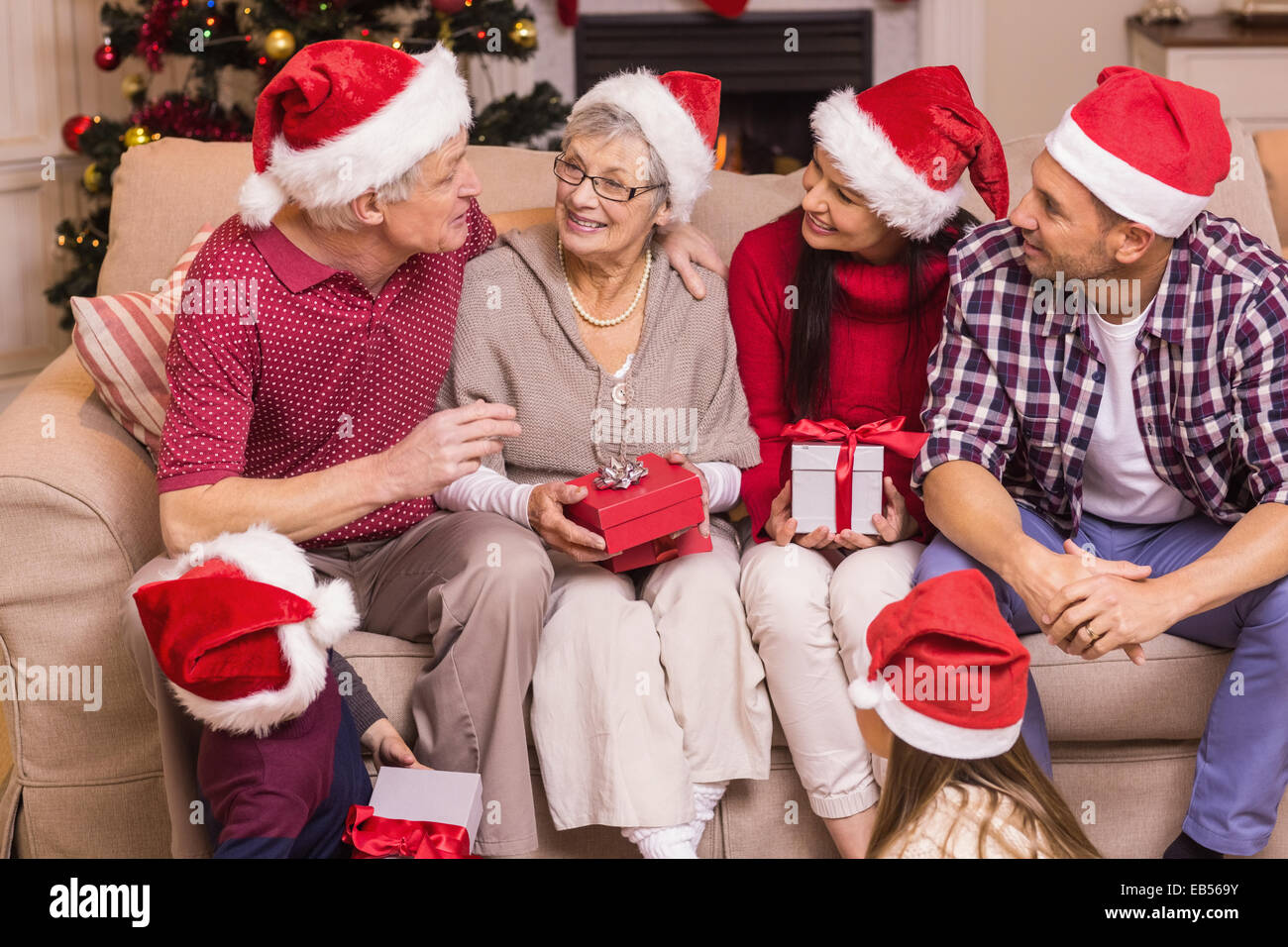 Festive family speaking together at christmas Stock Photo - Alamy