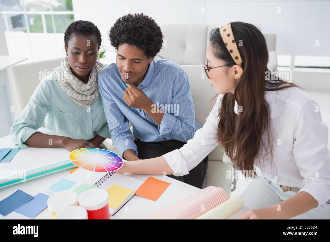 Interior designer speaking with clients Stock Photo - Alamy