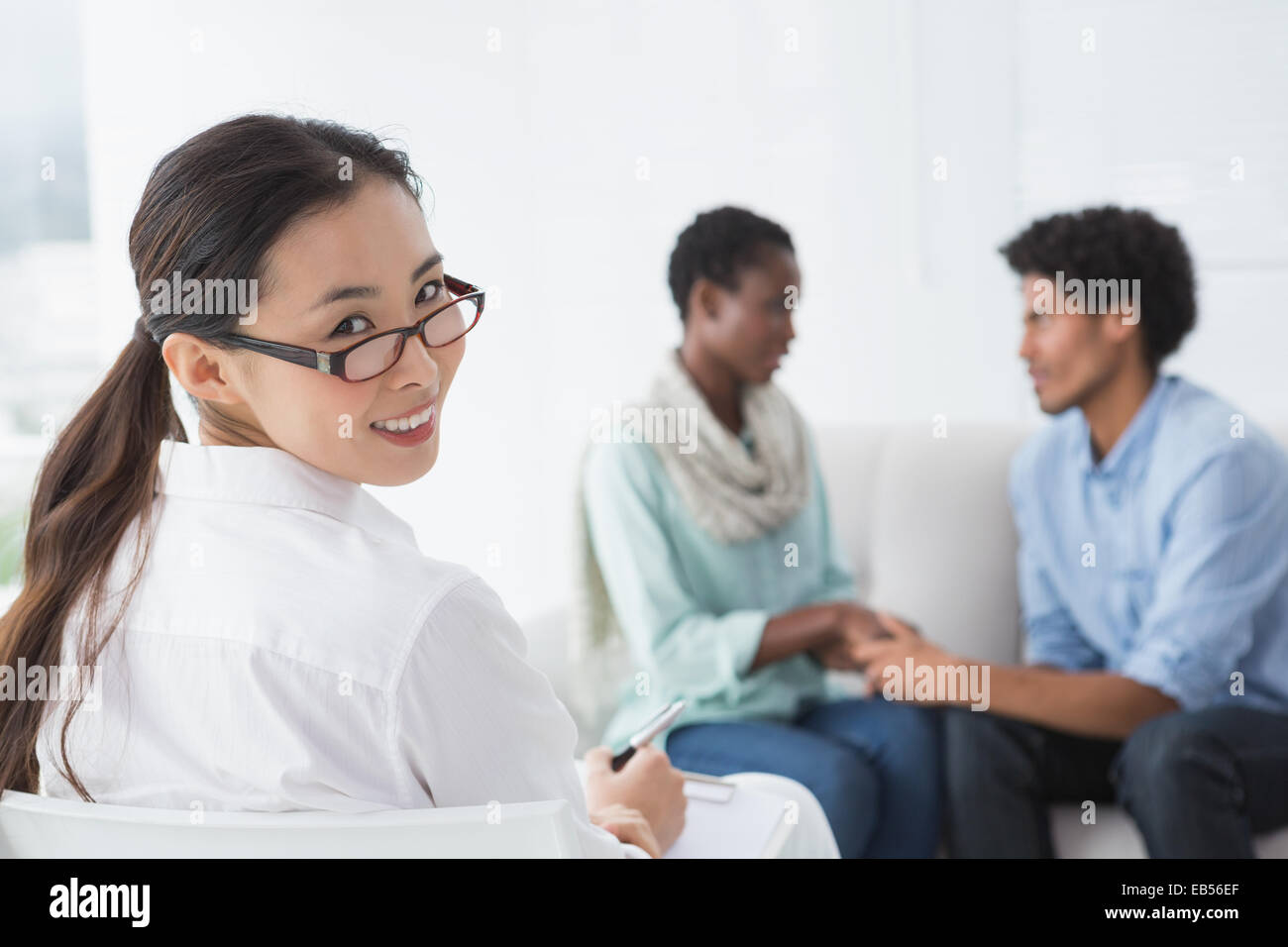 Reconciled couple smiling at each other Stock Photo - Alamy