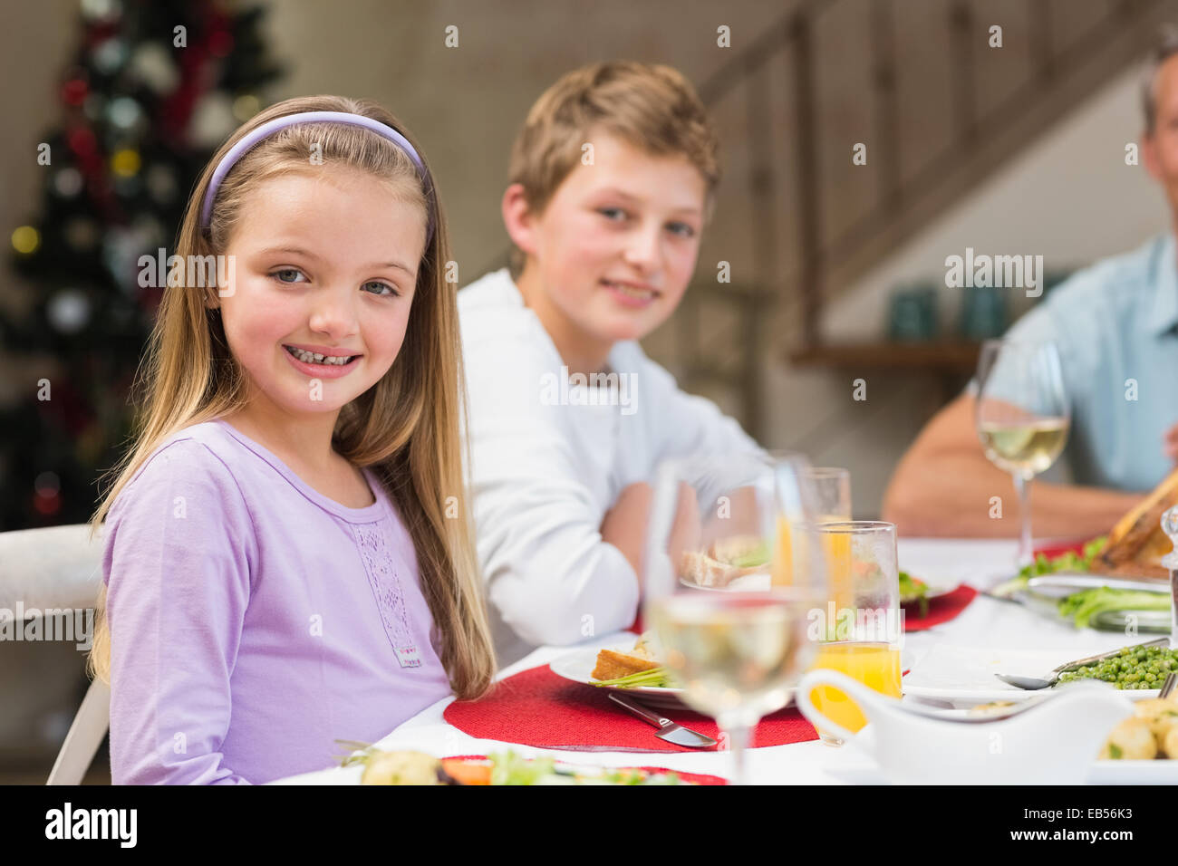 Portrait of smiling little girl at christmas dinner Stock Photo - Alamy