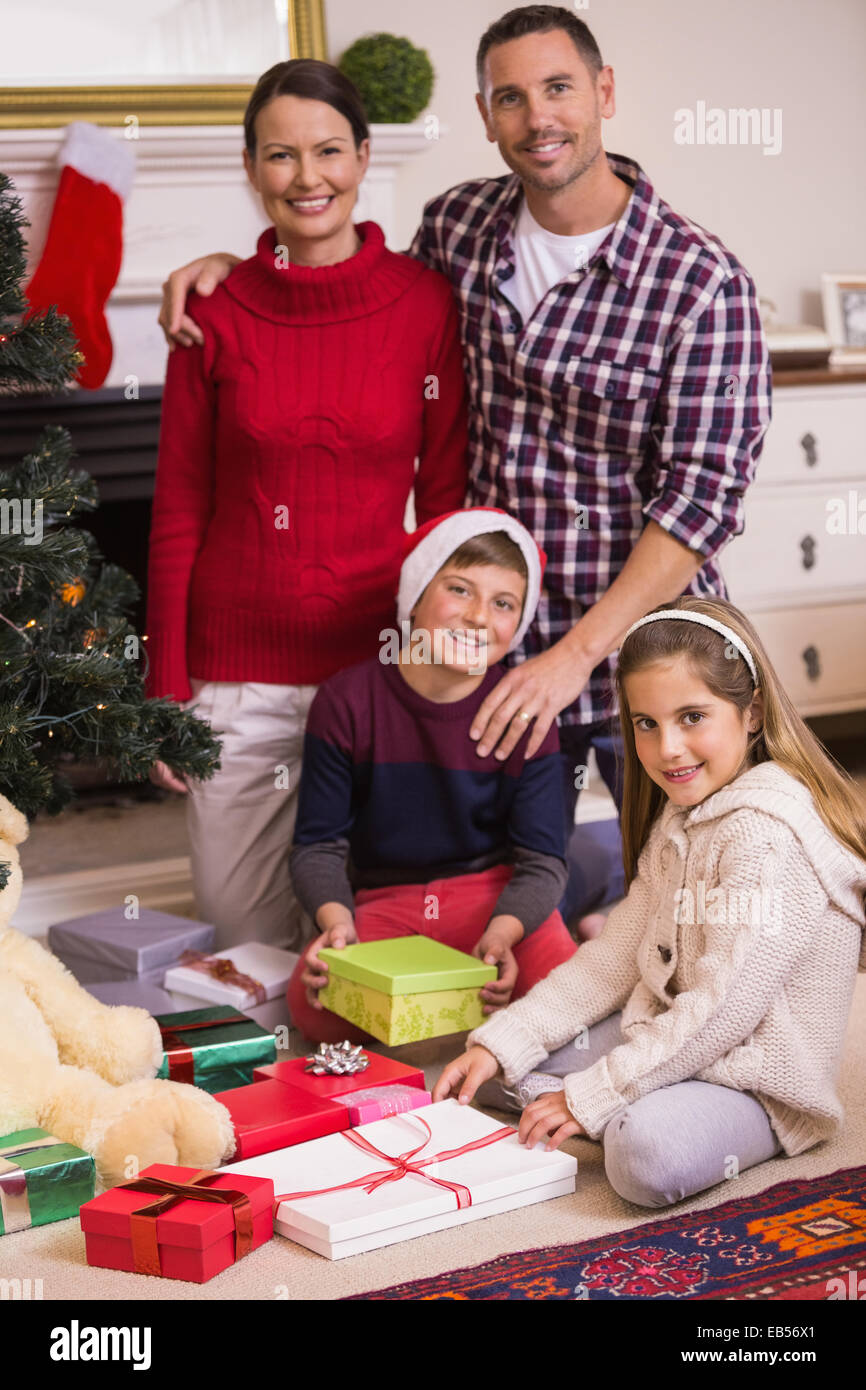 Happy family opening present hi-res stock photography and images - Alamy