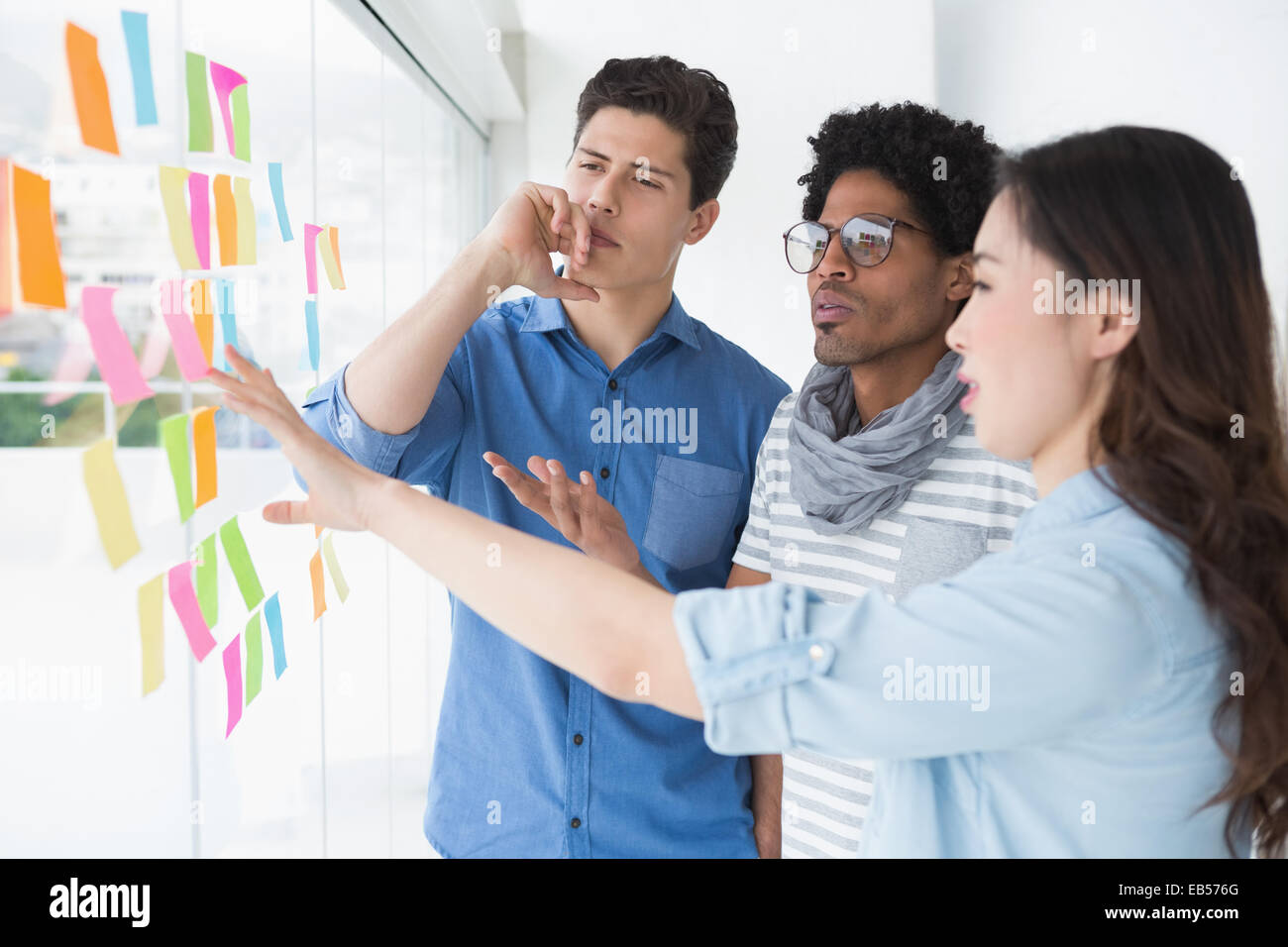 Young creative team brainstorming together Stock Photo - Alamy