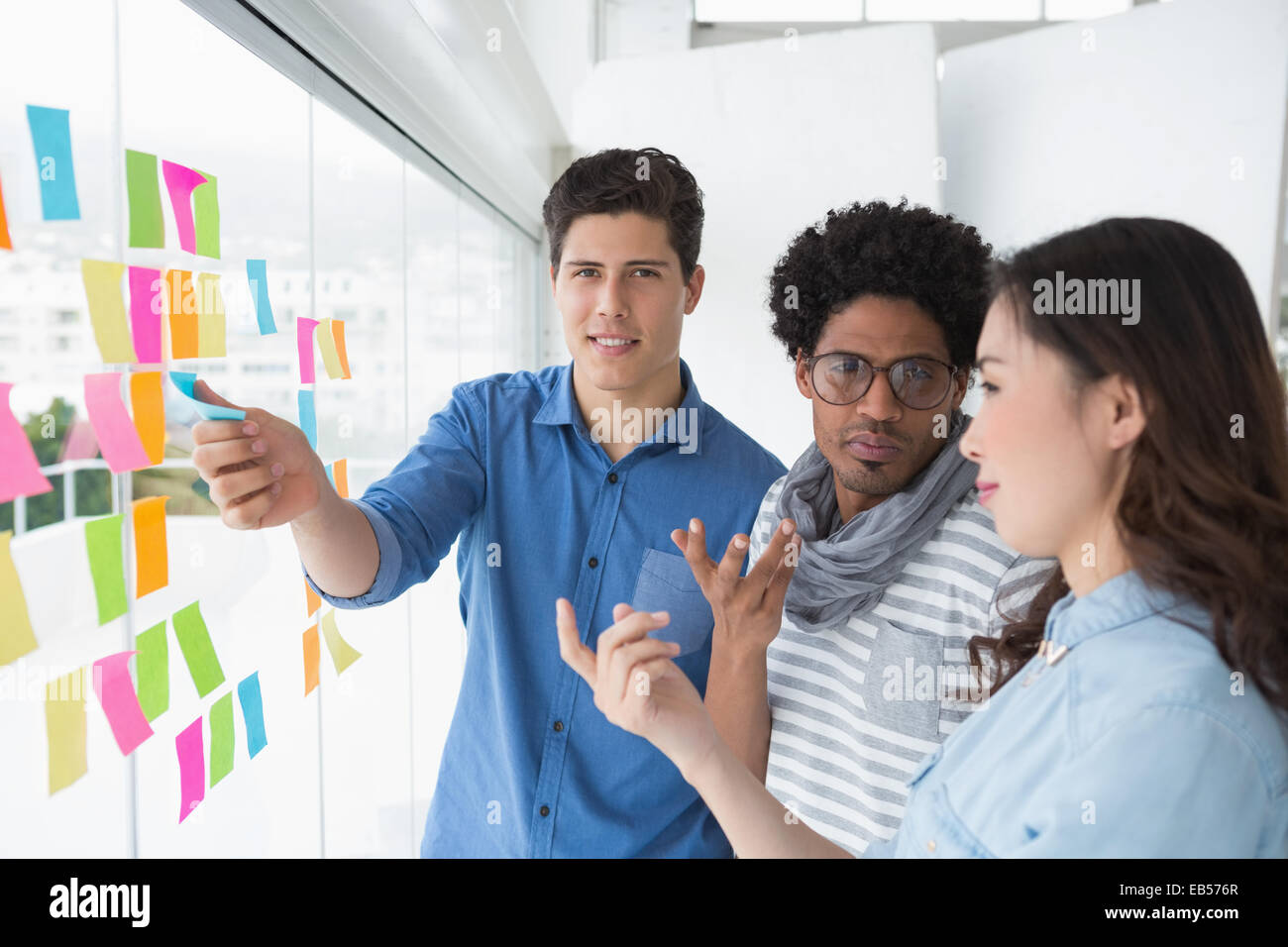 Young creative team brainstorming together Stock Photo - Alamy