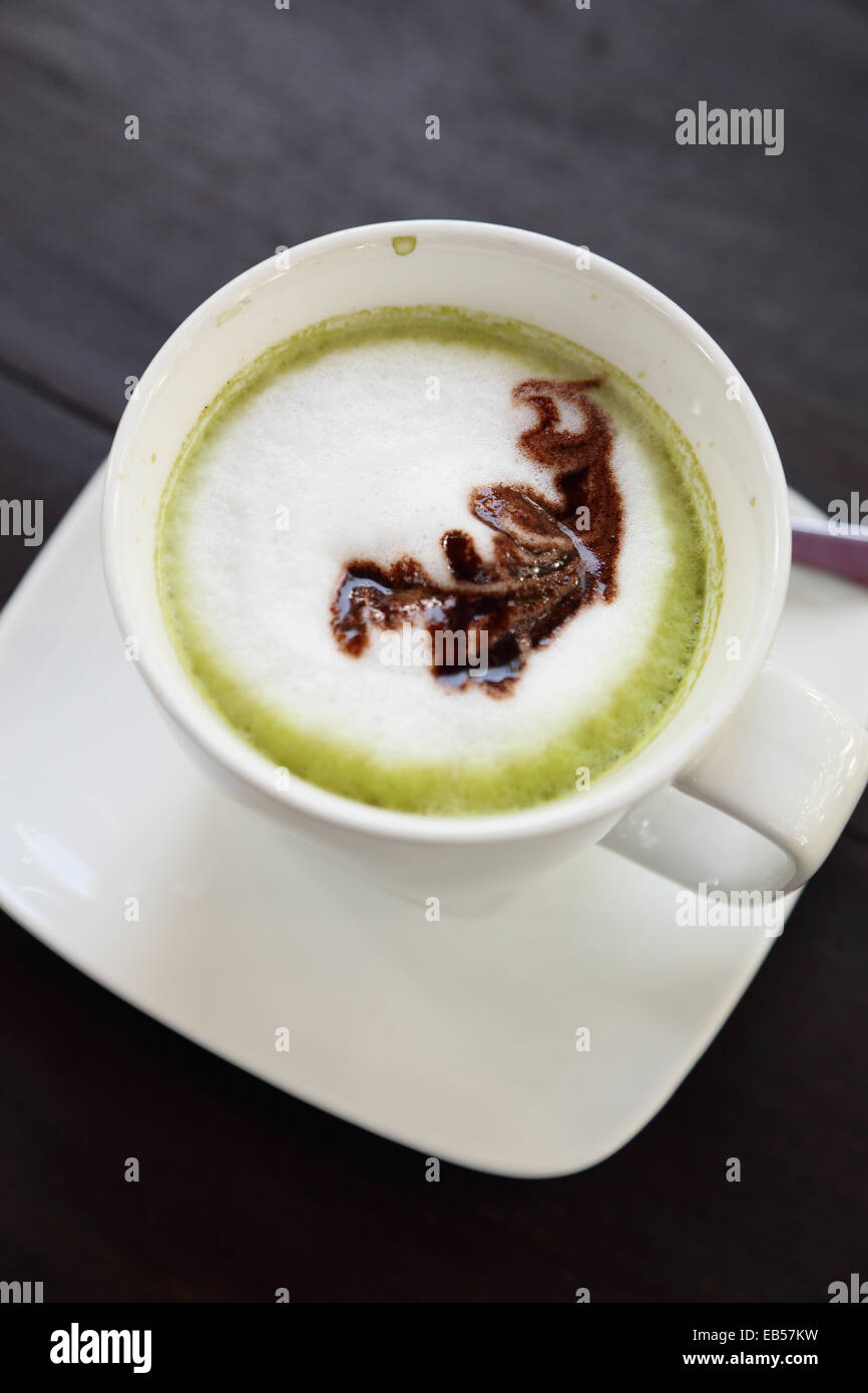 Cup of hot matcha green tea latte with milk cream Stock Photo - Alamy