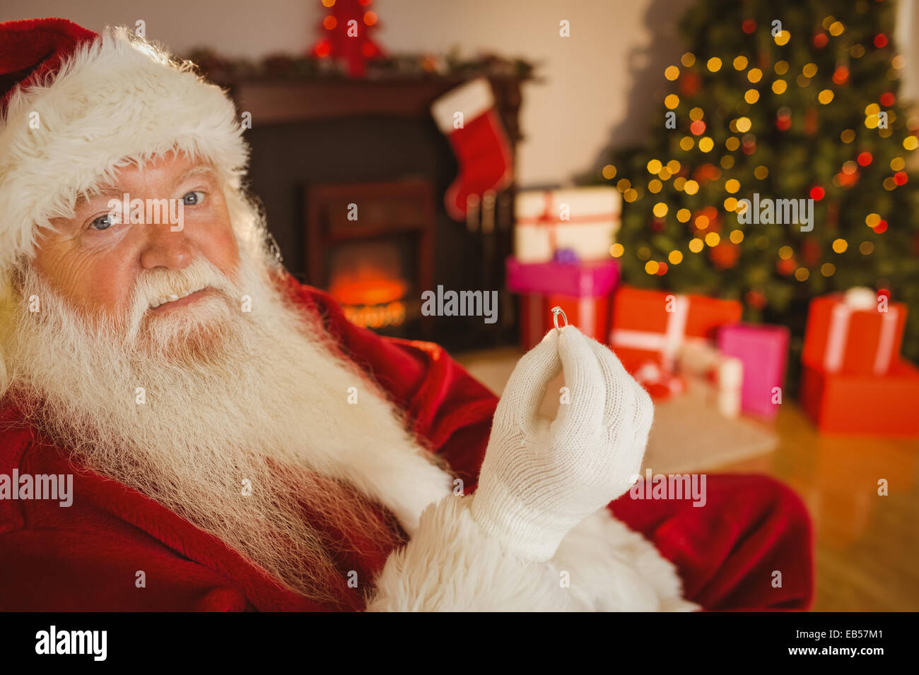 Santa claus holding engagement ring hi-res stock photography and images ...