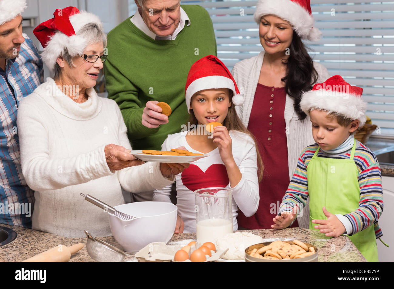 Multi-generation family baking together Stock Photo - Alamy