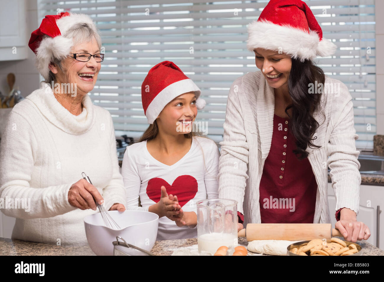 Multi-generation family baking together Stock Photo - Alamy