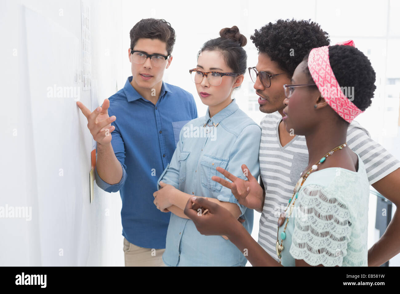 Young creative team brainstorming together Stock Photo - Alamy