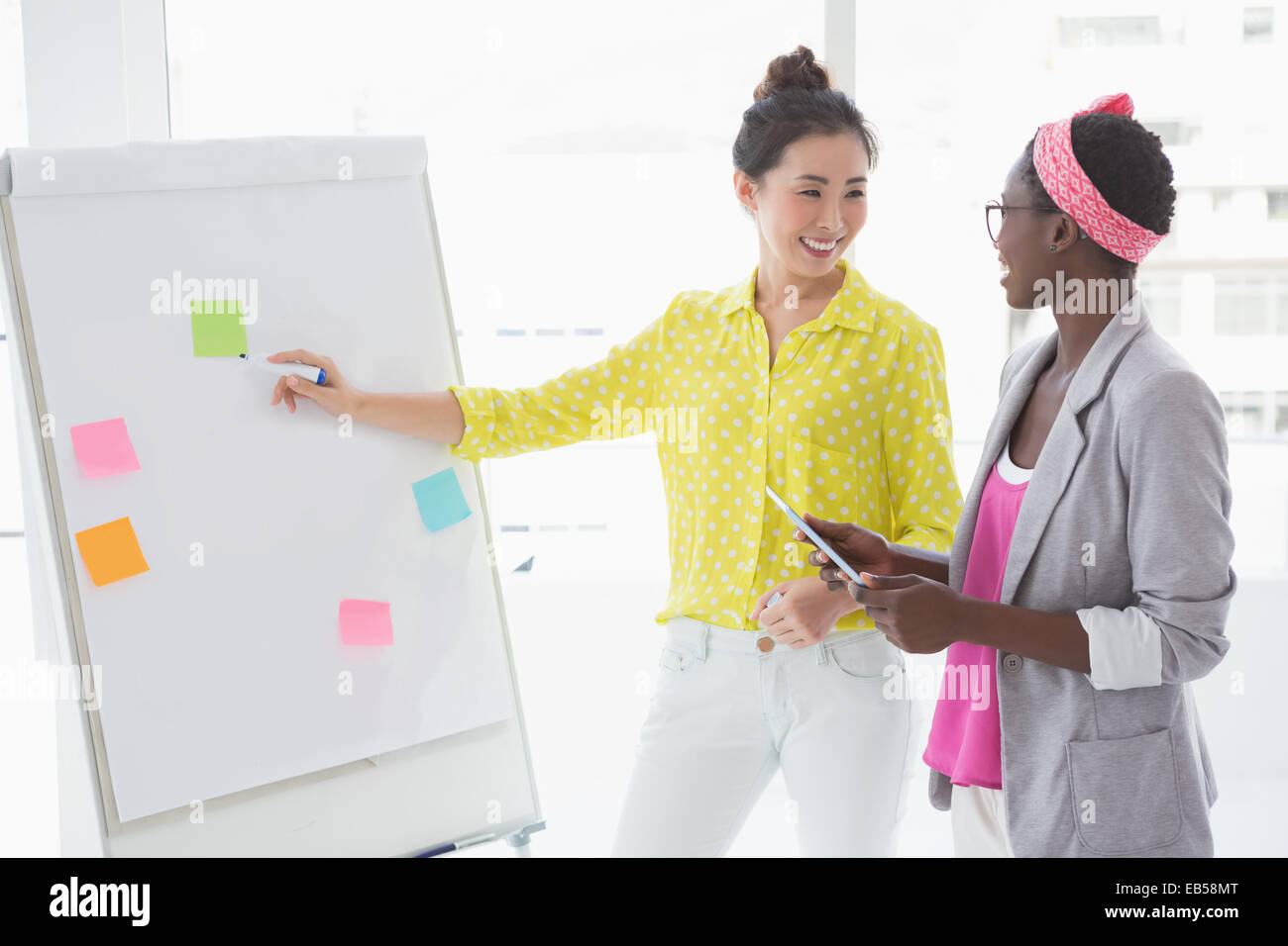 Young creative women brainstorming together Stock Photo - Alamy