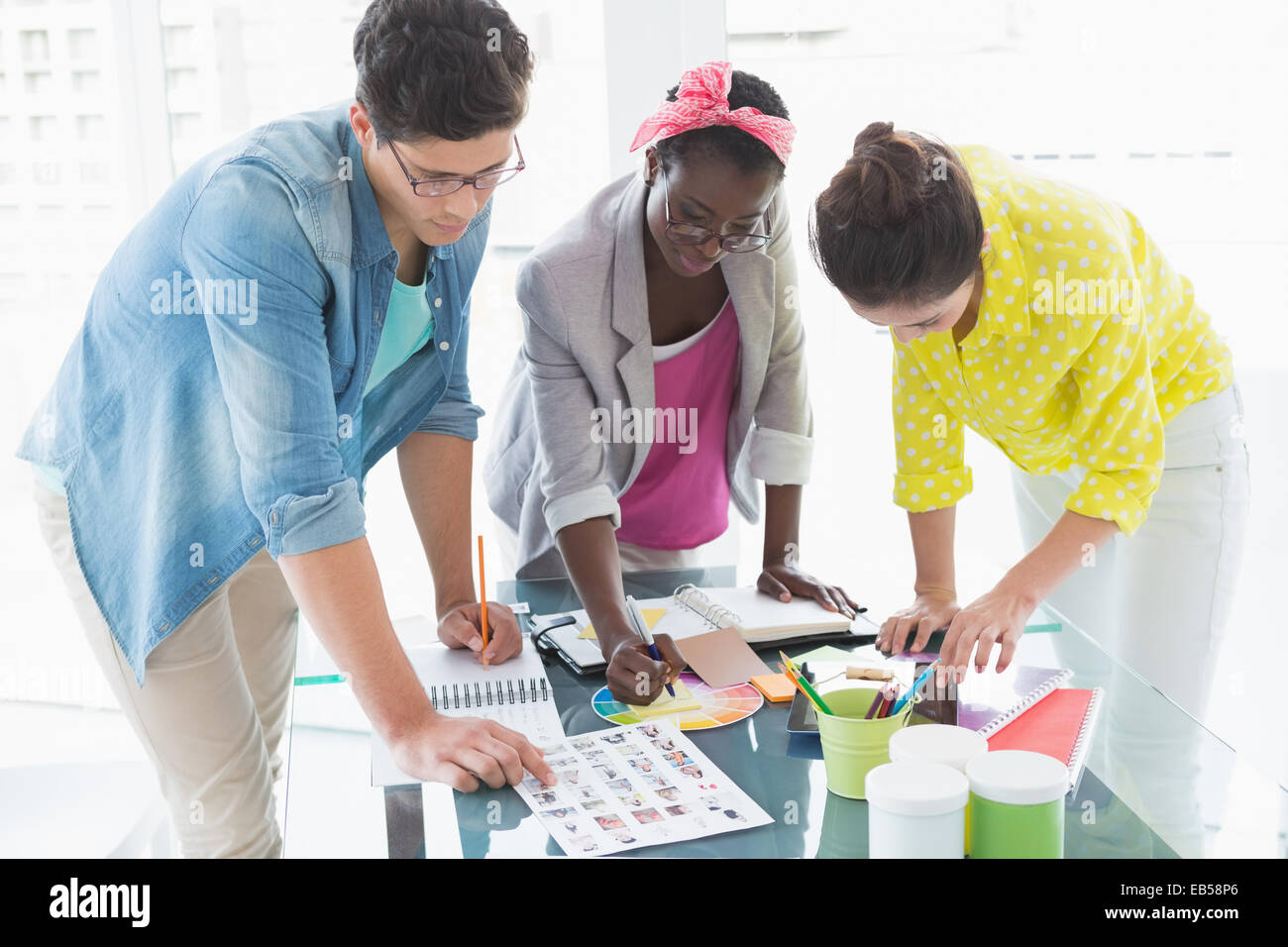Young creative team having a meeting Stock Photo - Alamy